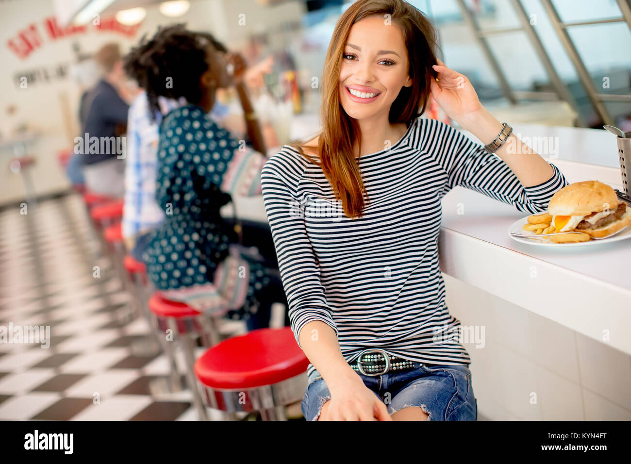 Attractive woman eating alone restaurant hi-res stock photography and ...