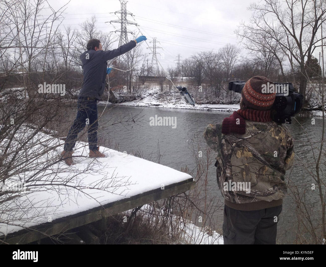 WHAT LIES UPSTREAM, Director Cullen Hoback (left), collecting a water ...