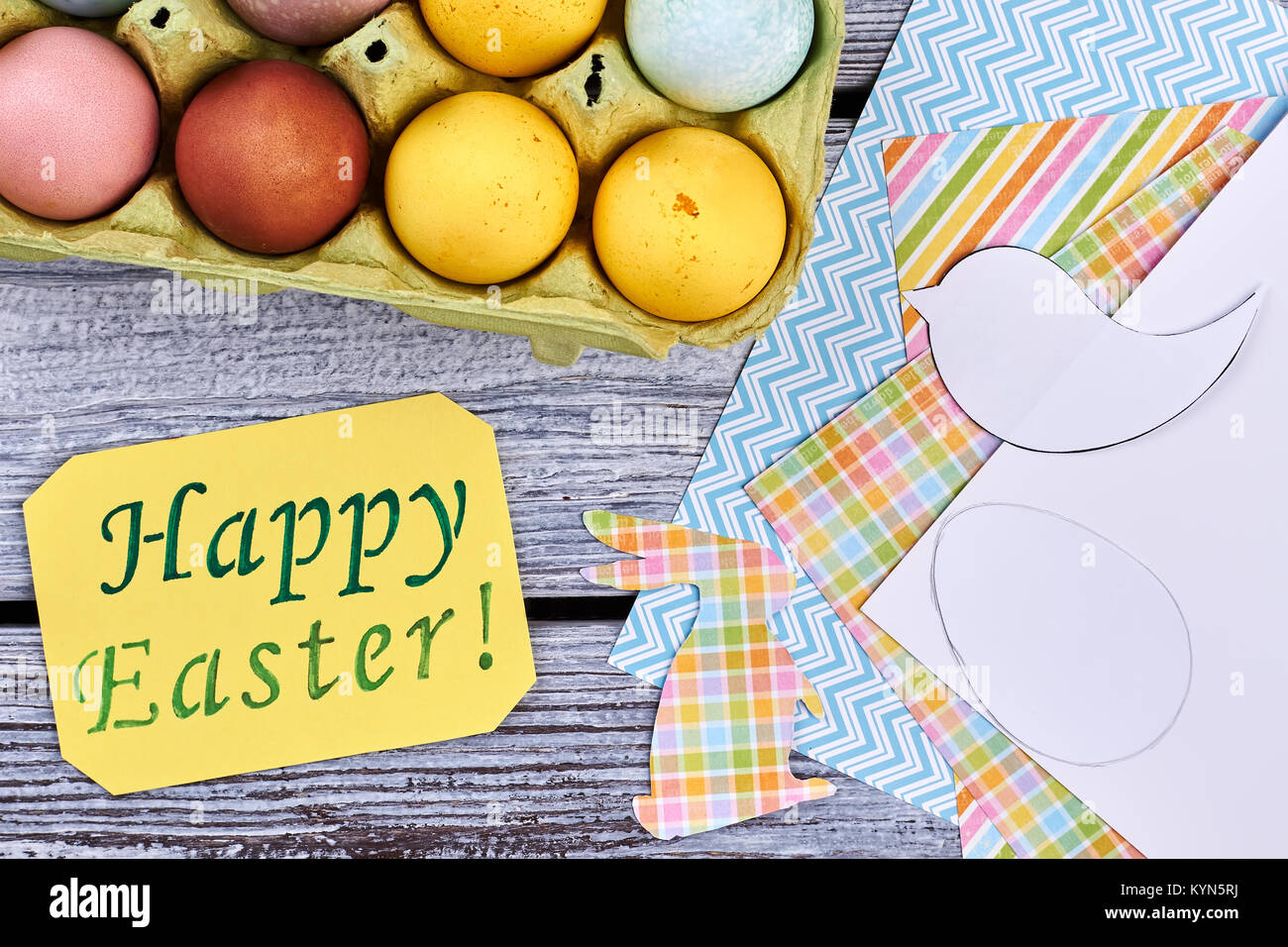 Happy Easter yellow card and eggs Stock Photo - Alamy