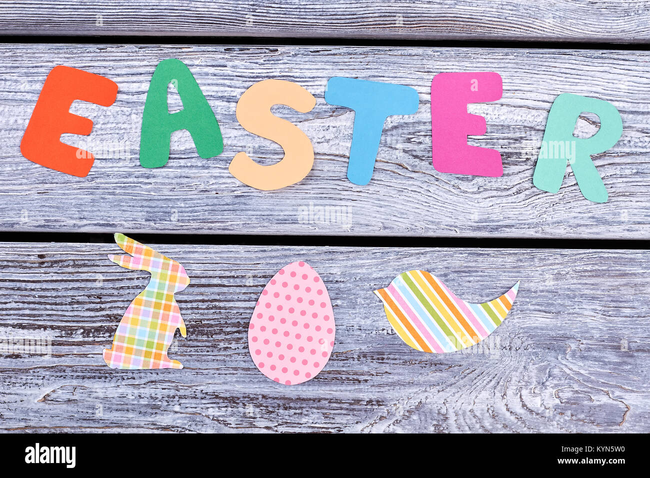 Easter colorful letters, wooden background Stock Photo - Alamy