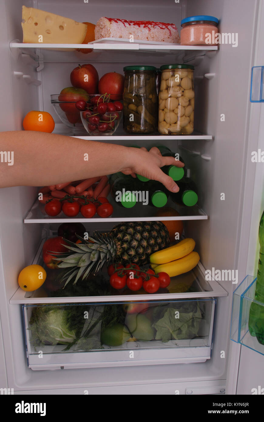Male hand picking food from refrigerator. Full of Healthy Food Options ...