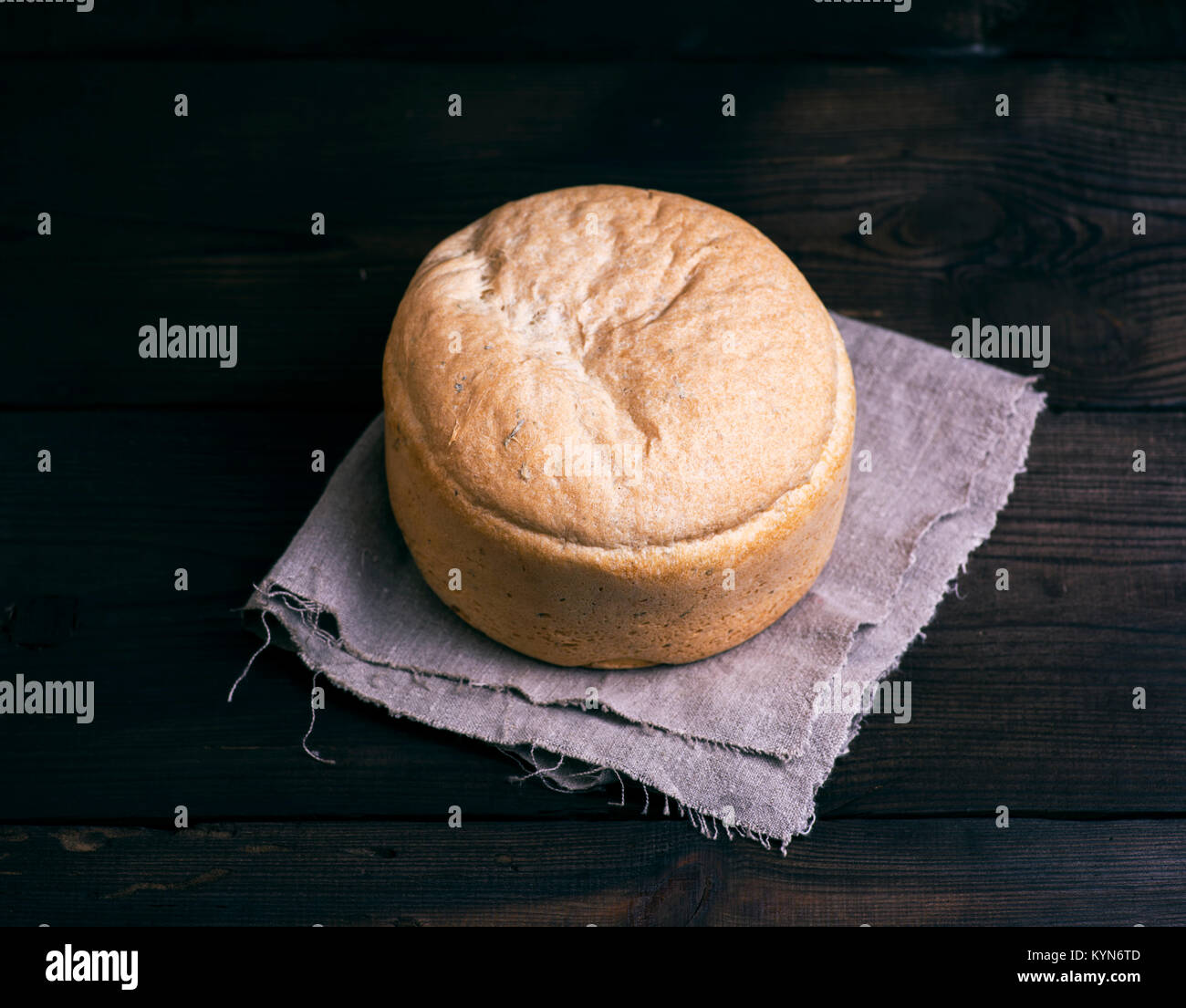round yeast bread baked from white wheat flour, vintage toning Stock ...