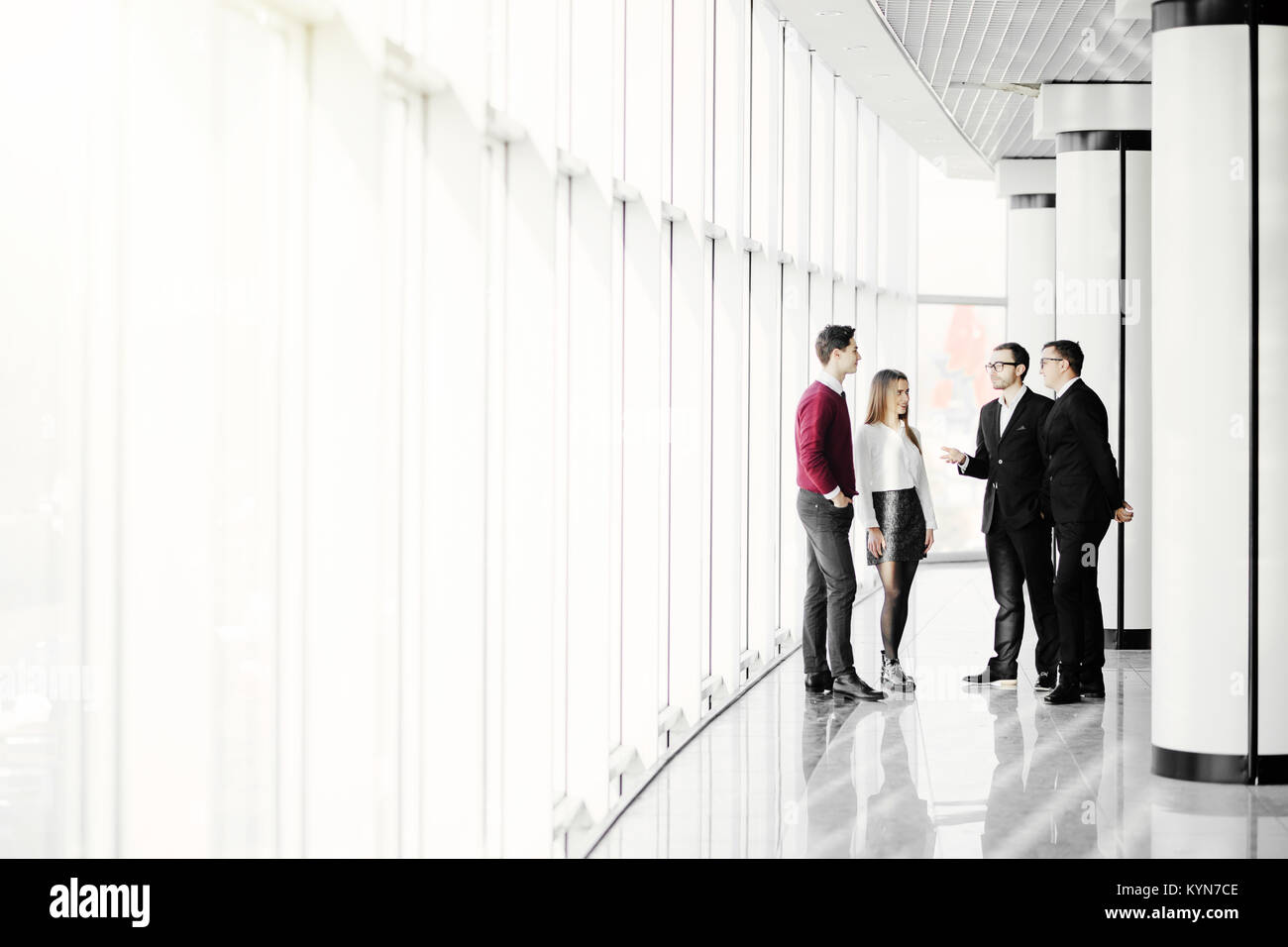 The business people walk in the office hall on window background Stock ...