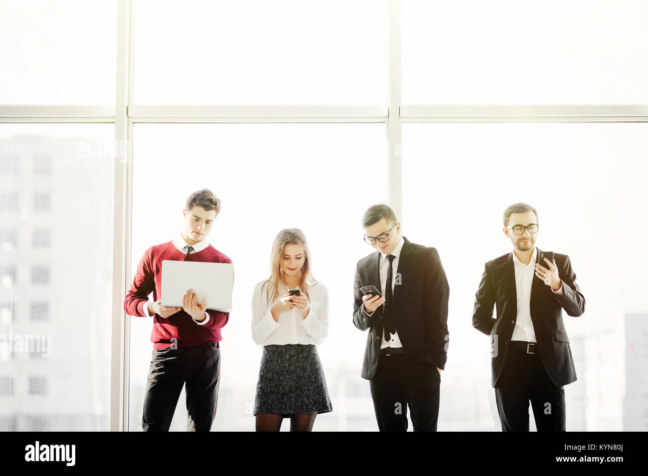 Group Business friends standing and using modern gadgets against ...