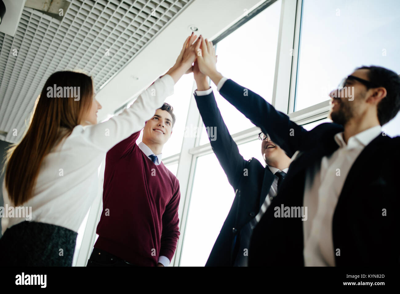 The happy business people greeting in modern office Stock Photo - Alamy