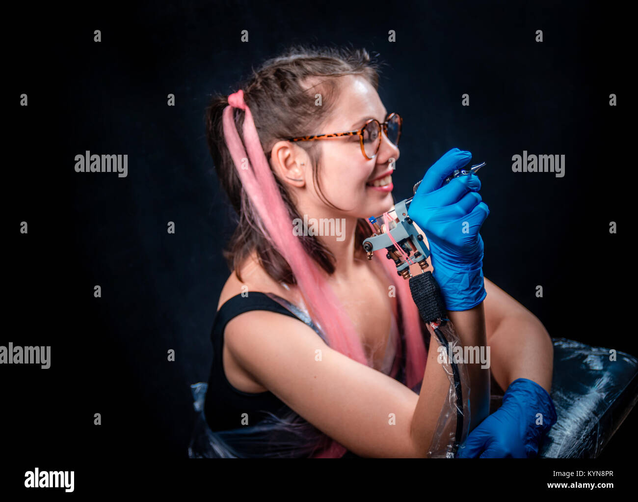 Professional tattooer poses for the camera in a tattoo studio Stock ...