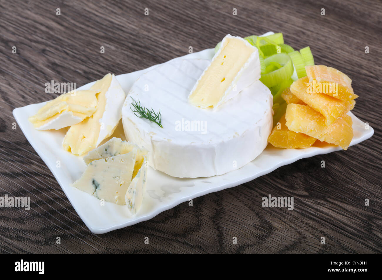 Cheese platter with brie, blue and parmesan Stock Photo - Alamy