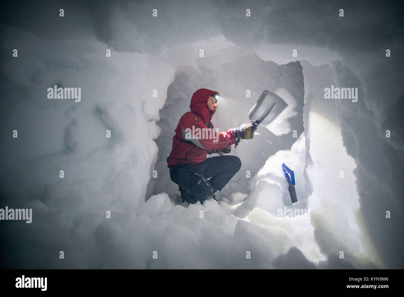 Digging out the snow hole from inside ©Paul Glendell Stock Photo - Alamy