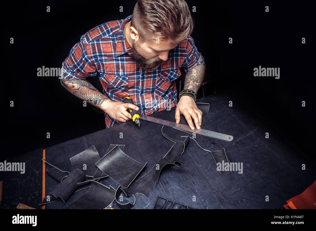 Professional Leather Worker producing leather workpiece Stock Photo - Alamy