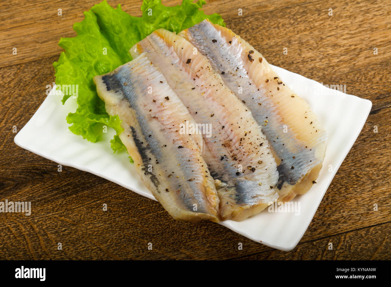 Herring fillet with pepper Stock Photo - Alamy