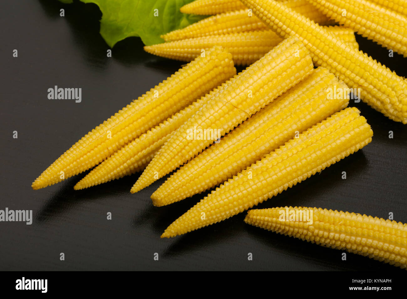 Young raw baby corn Stock Photo - Alamy