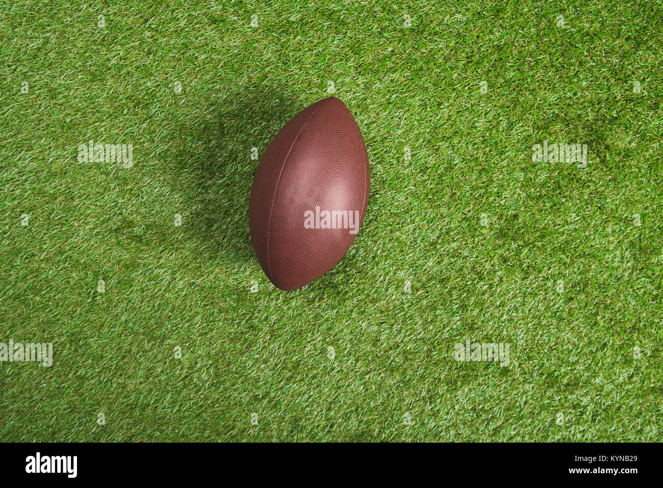 Top view of brown leather rugby ball on green grass Stock Photo - Alamy
