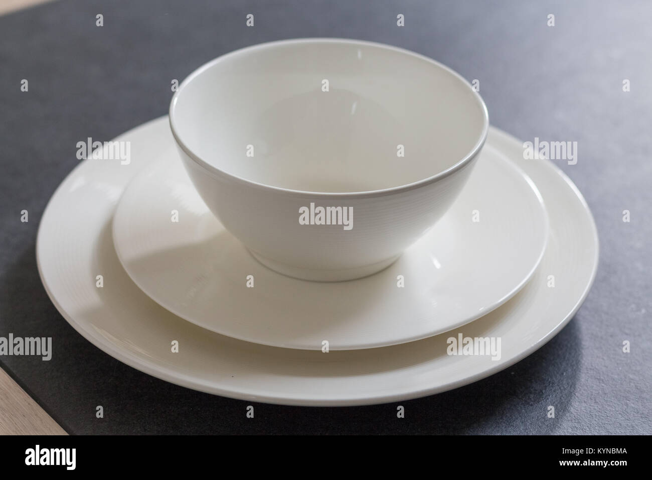 Table setting with dinner plate empty round white plate on dark ...
