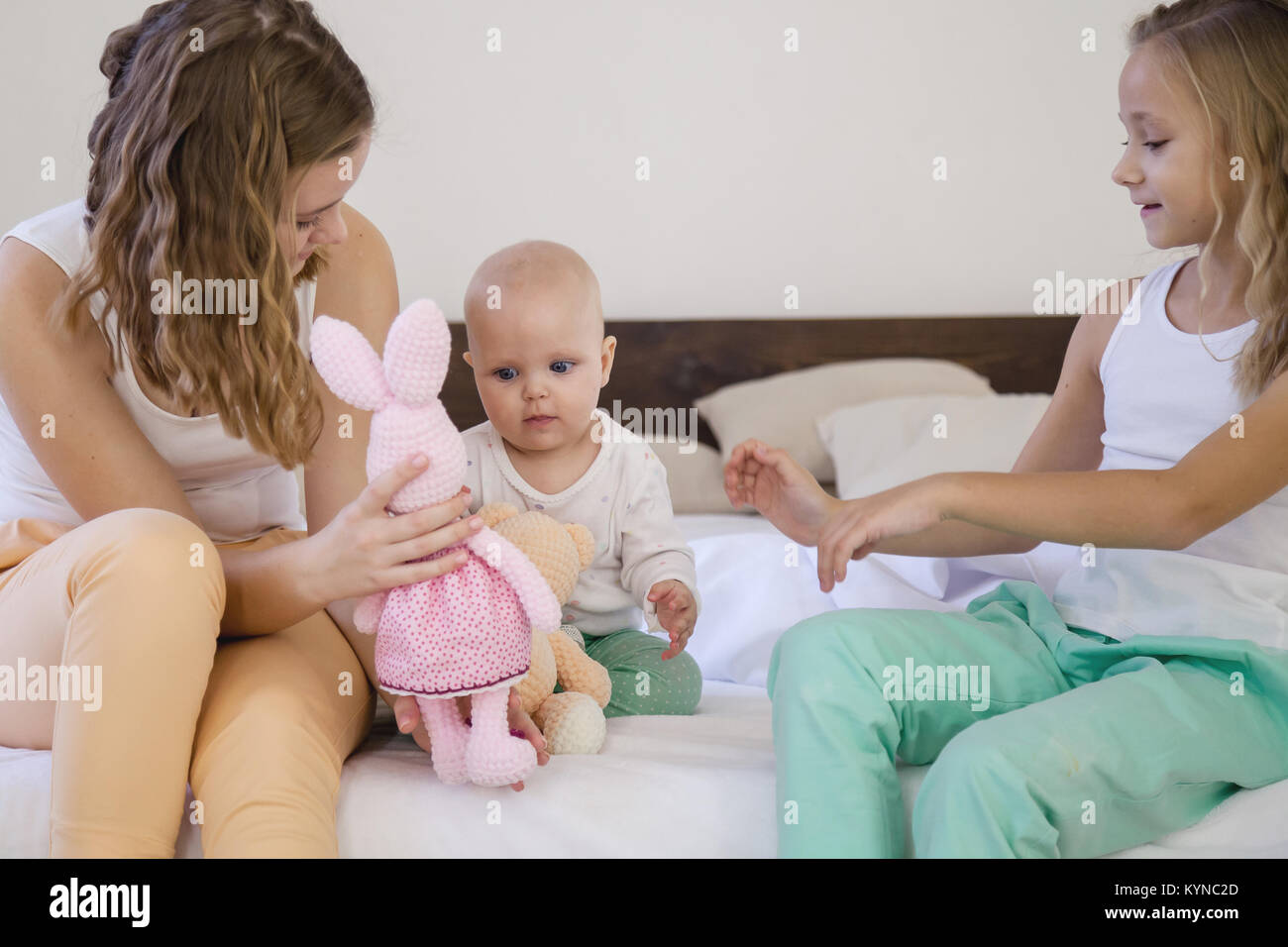 three sisters play children in the morning in the bedroom Stock Photo ...