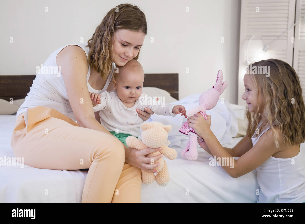 three sisters play children in the morning in the bedroom Stock Photo ...