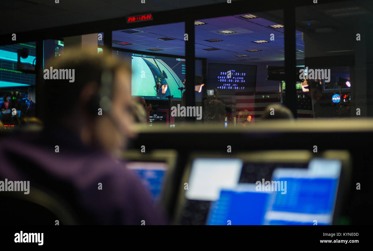 A monitor in mission control shows the time remaining until Cassini ...