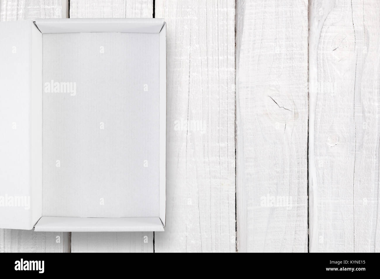 Opened white box with cover on white wooden background top view Stock ...