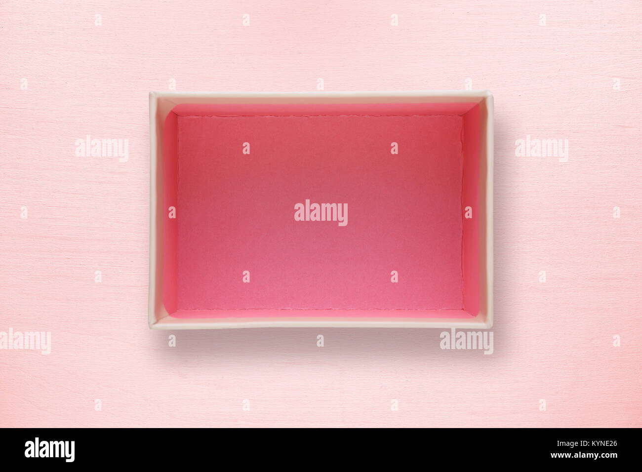 Opened box top view on pink background Stock Photo - Alamy