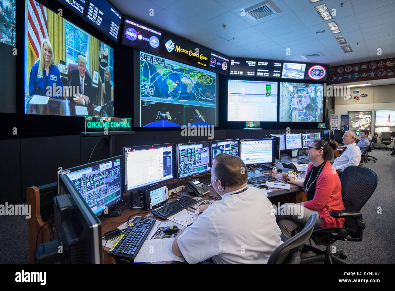 NASA Mission Control staff, including Flight Director Brian Smith and ...
