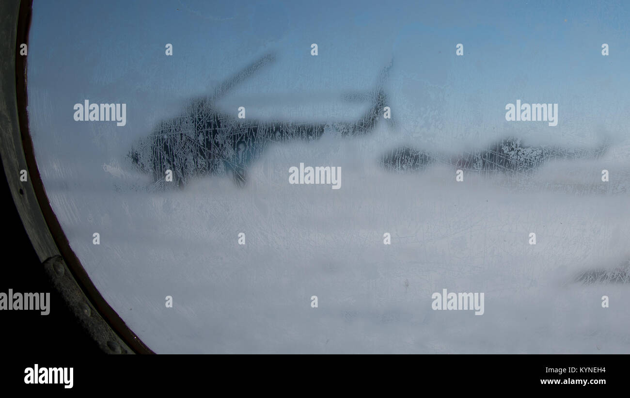 Russian helicopters are seen through the frozen window of another ...