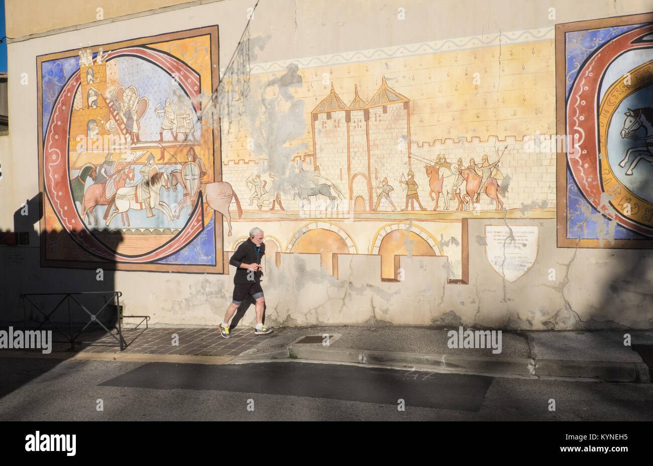jogger,jogging,runner,run,passing,mural,wall,painting,of,historical ...
