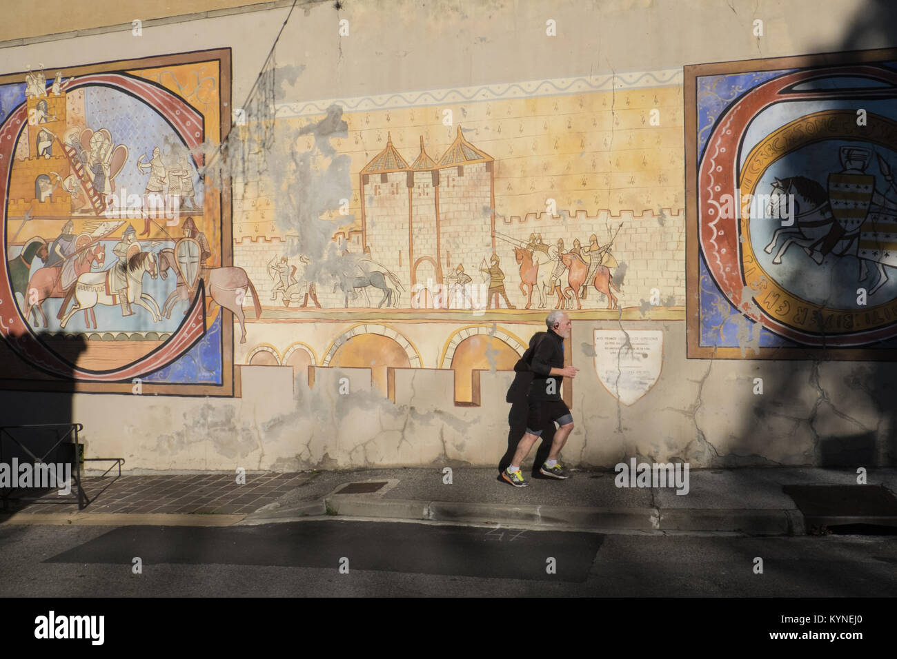 jogger,jogging,runner,run,passing,mural,wall,painting,of,historical ...