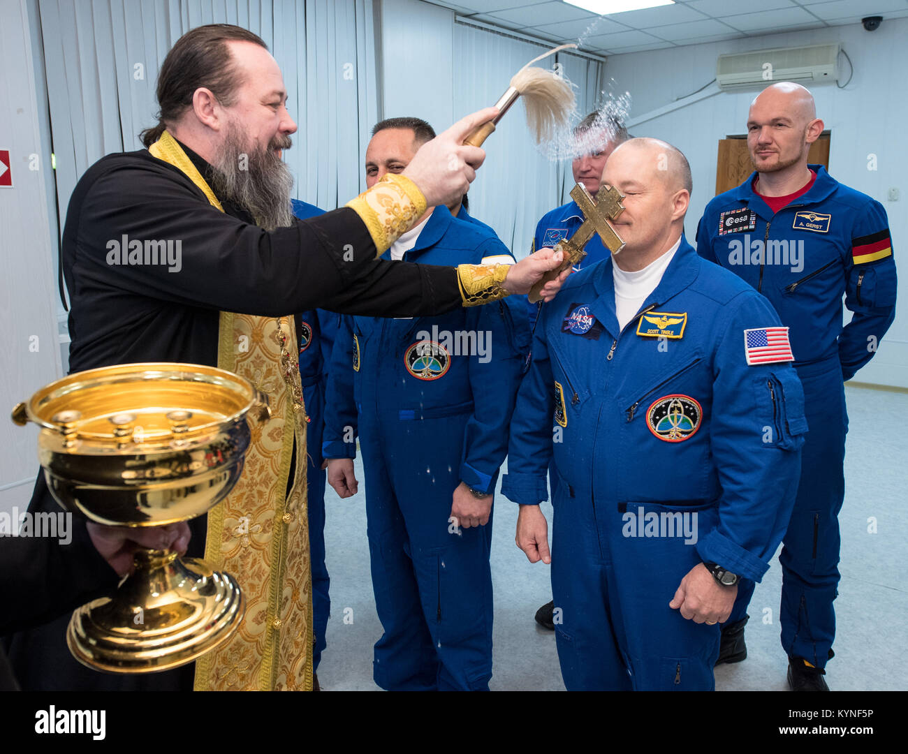 Scott Tingle of NASA receives a blessing from a Russian Orthodox Priest ...