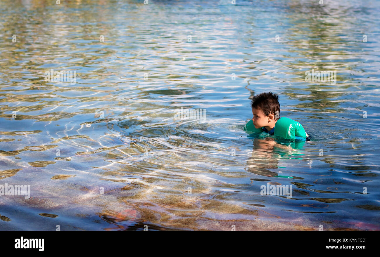 Little Boy in water Stock Photo - Alamy