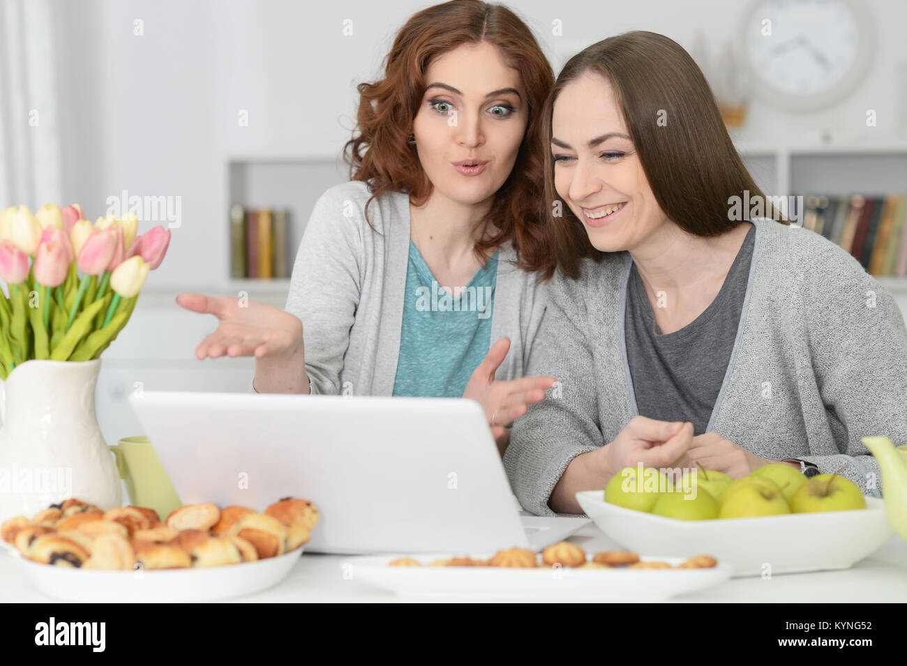 two young women using laptop Stock Photo - Alamy