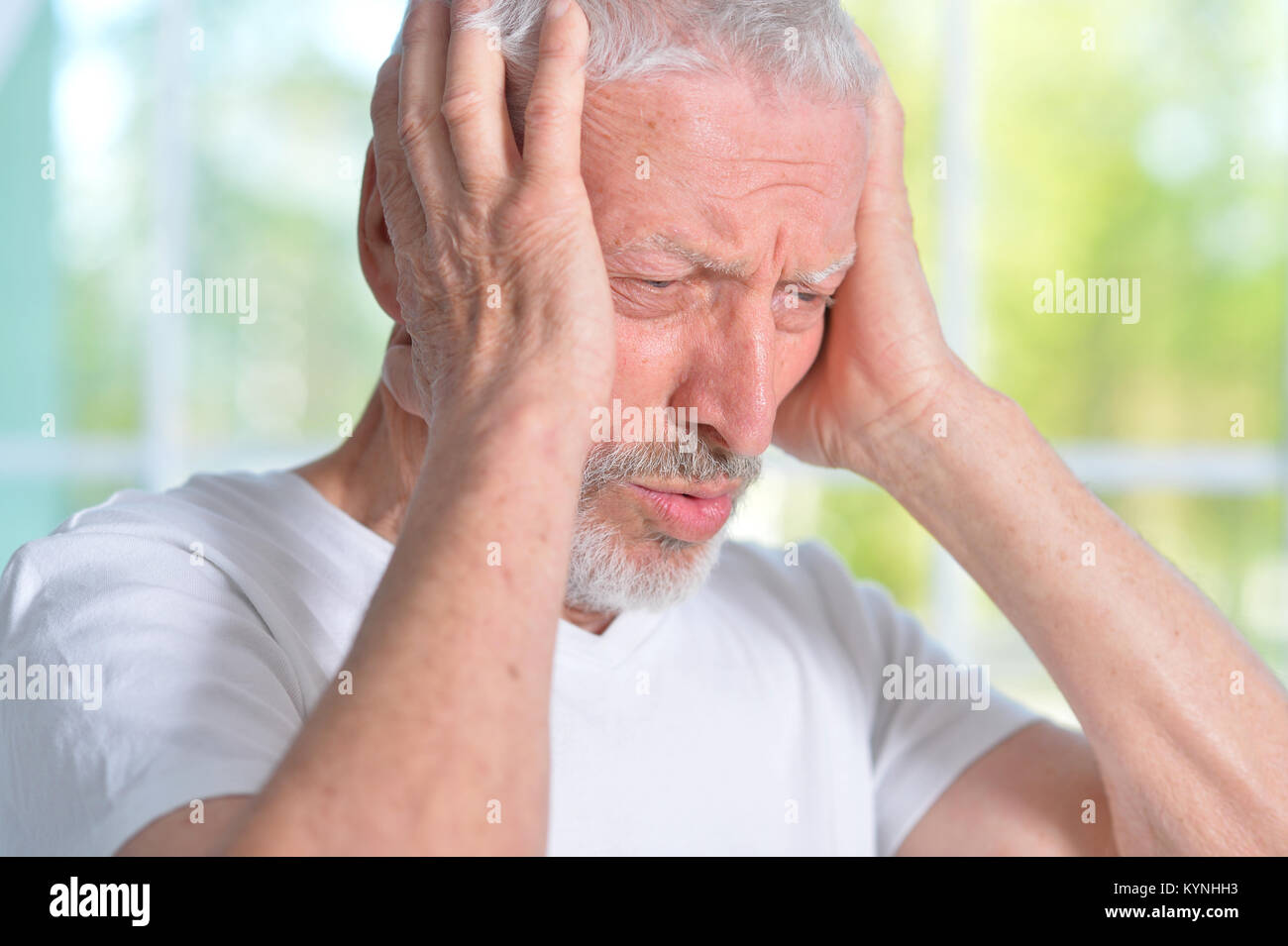 Sad senior man at home Stock Photo - Alamy