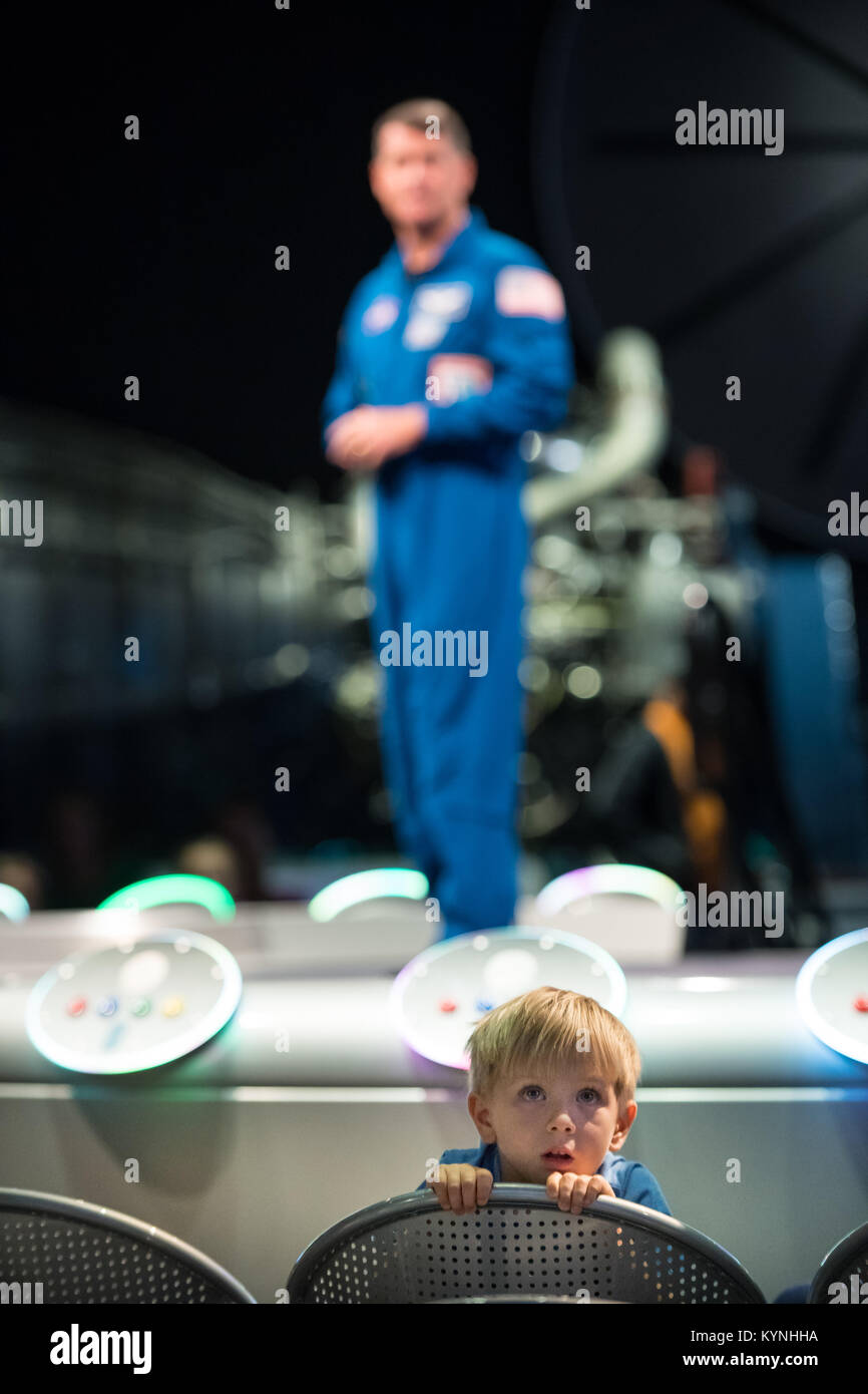 A young audience member listens while NASA astronaut Shane Kimbrough ...