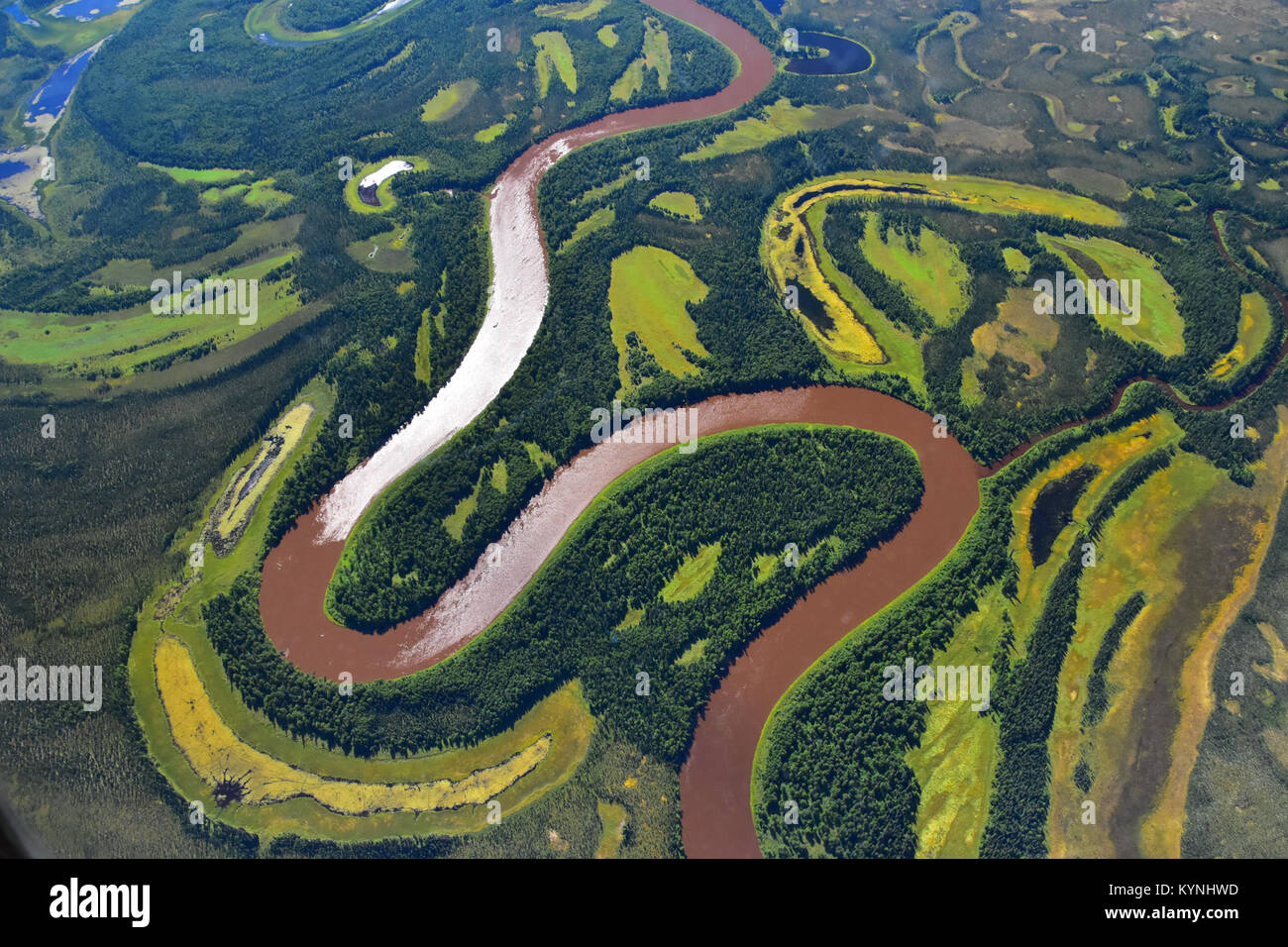 NASA scientists conduct an aerial observation over Alaska, contributing ...