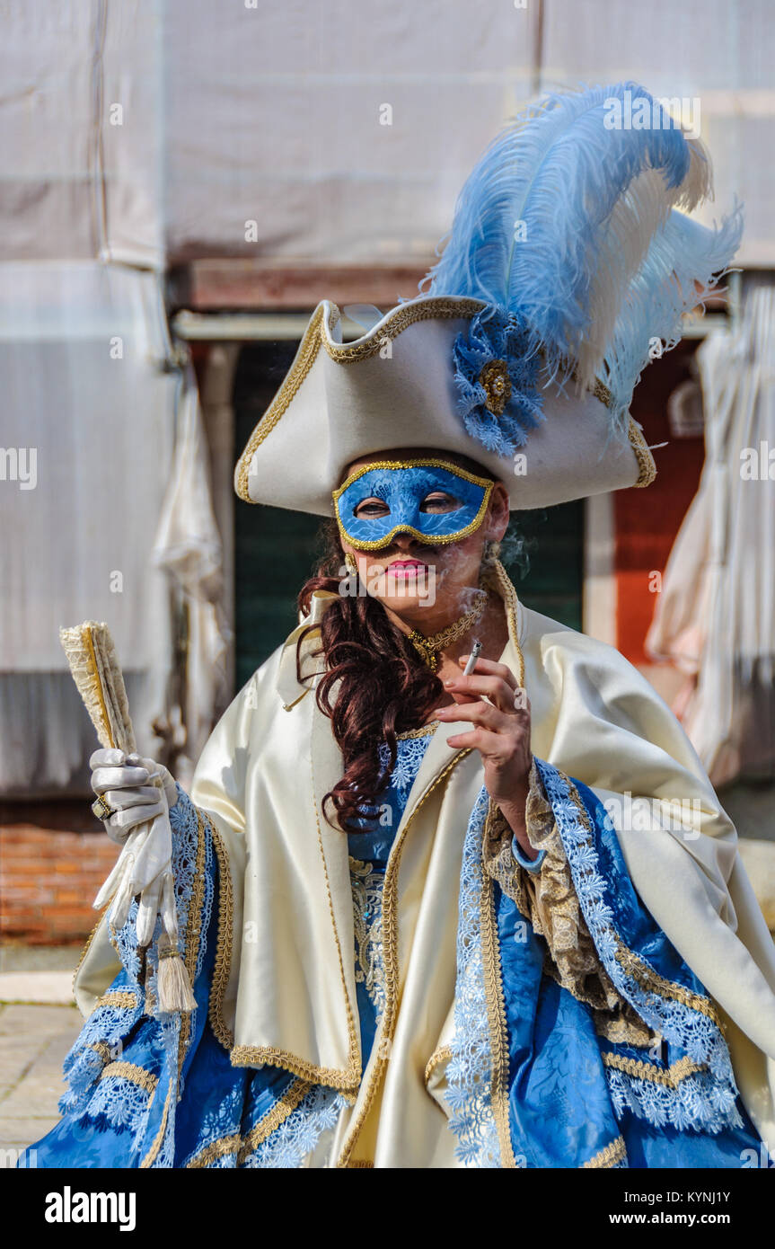Woman in mask smoking during the Carnival in Venica, Italy Stock Photo ...