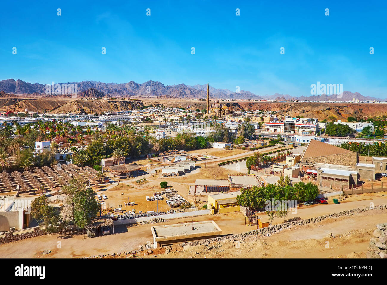 The cityscape of Sharm El Maya district with tall minaret of Al Sahaba ...