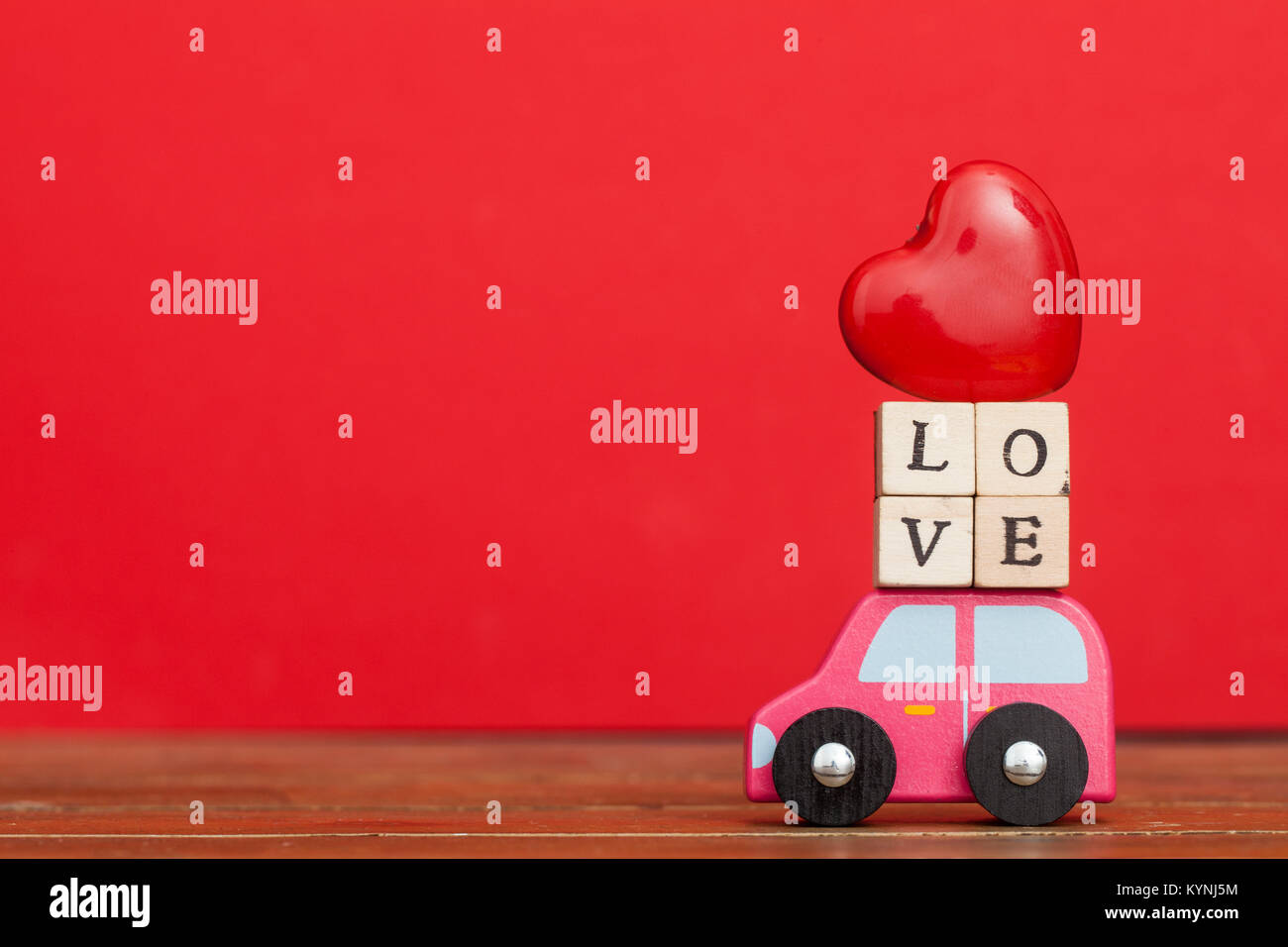 Wooden toy car heart roof hi-res stock photography and images - Alamy