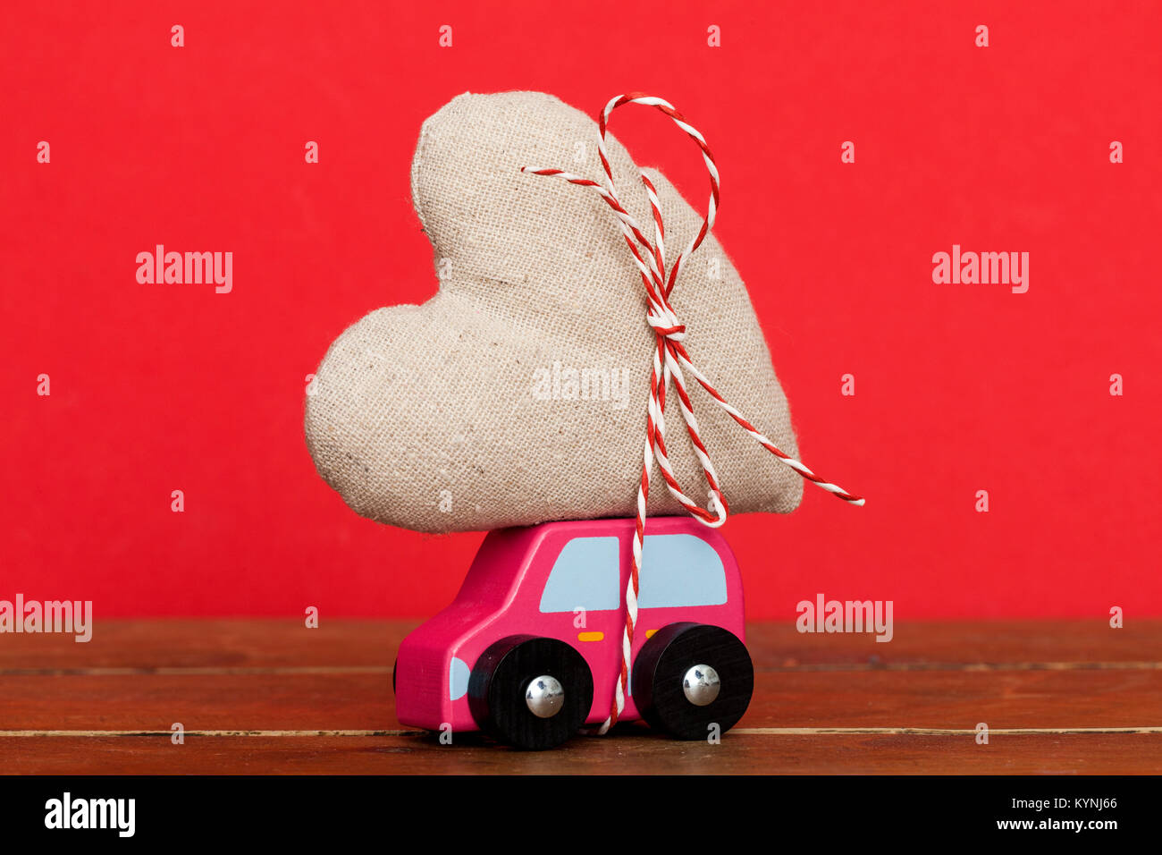 Wooden toy car heart roof hi-res stock photography and images - Alamy