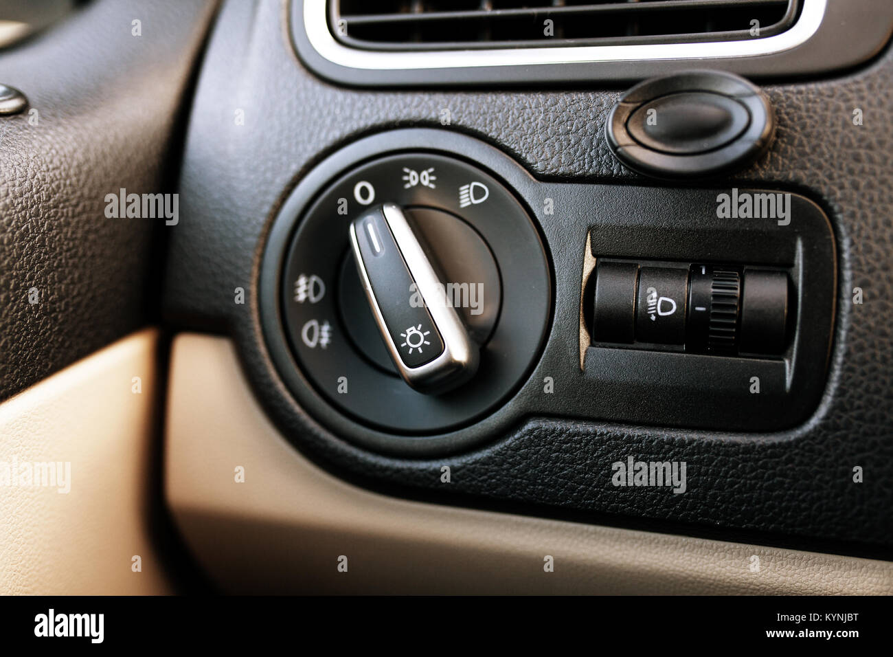 Lights control dial in a modern car Stock Photo - Alamy