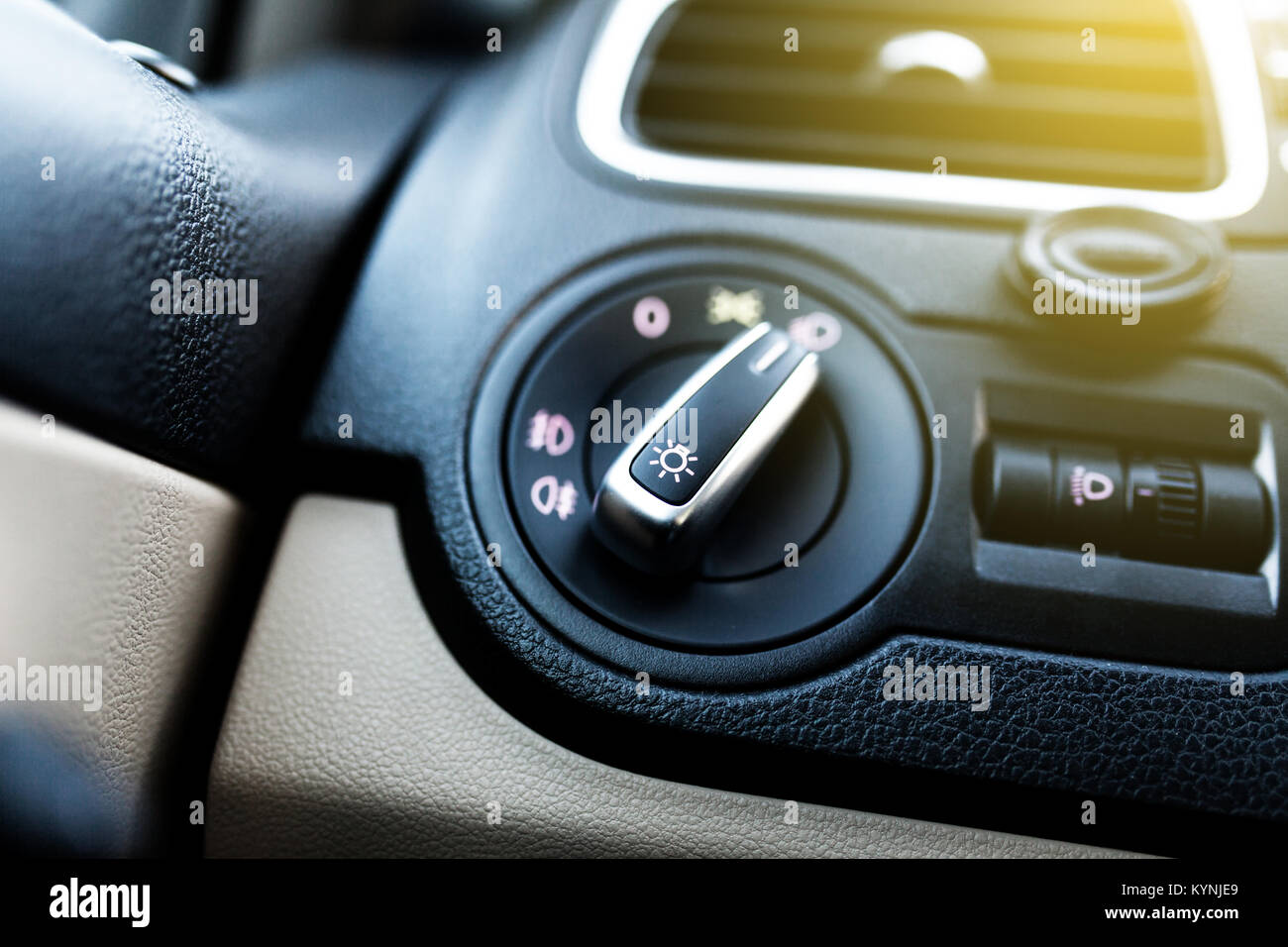 Lights control dial in a modern car Stock Photo - Alamy