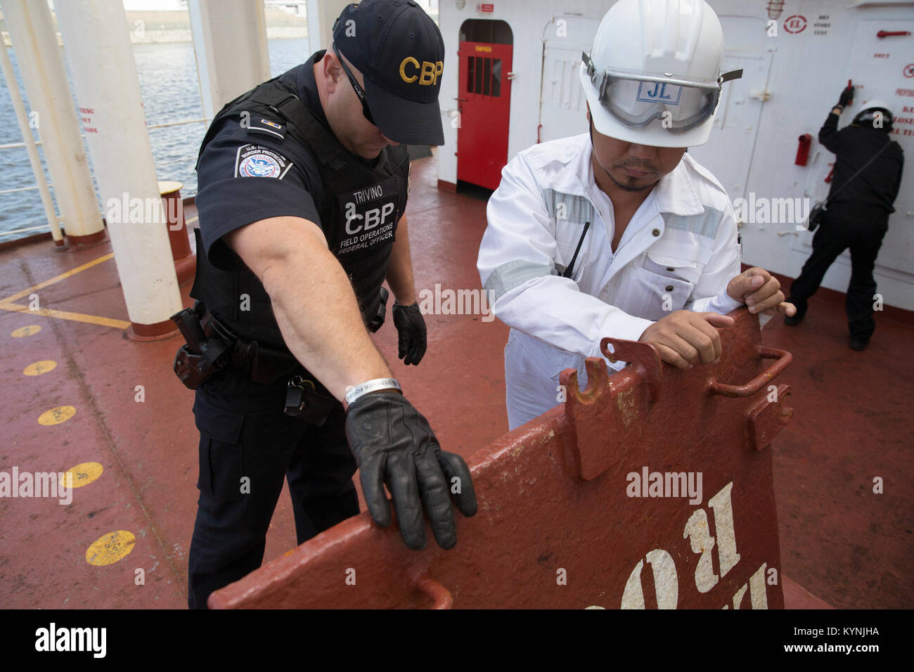 Customs border protection officers inspect hi-res stock photography and ...