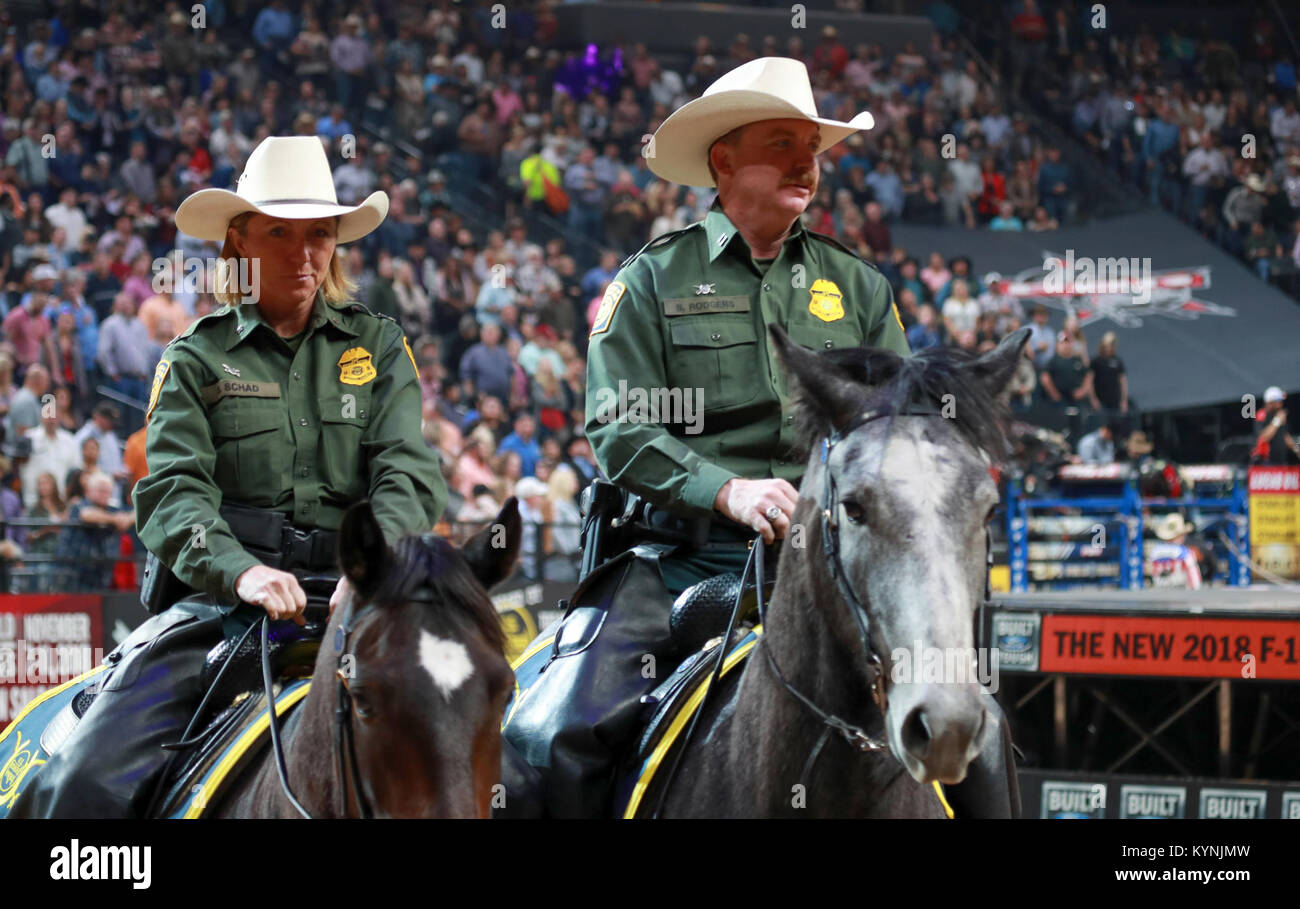 Two U.S. Border Patrol agents on horseback attend the opening ceremony ...