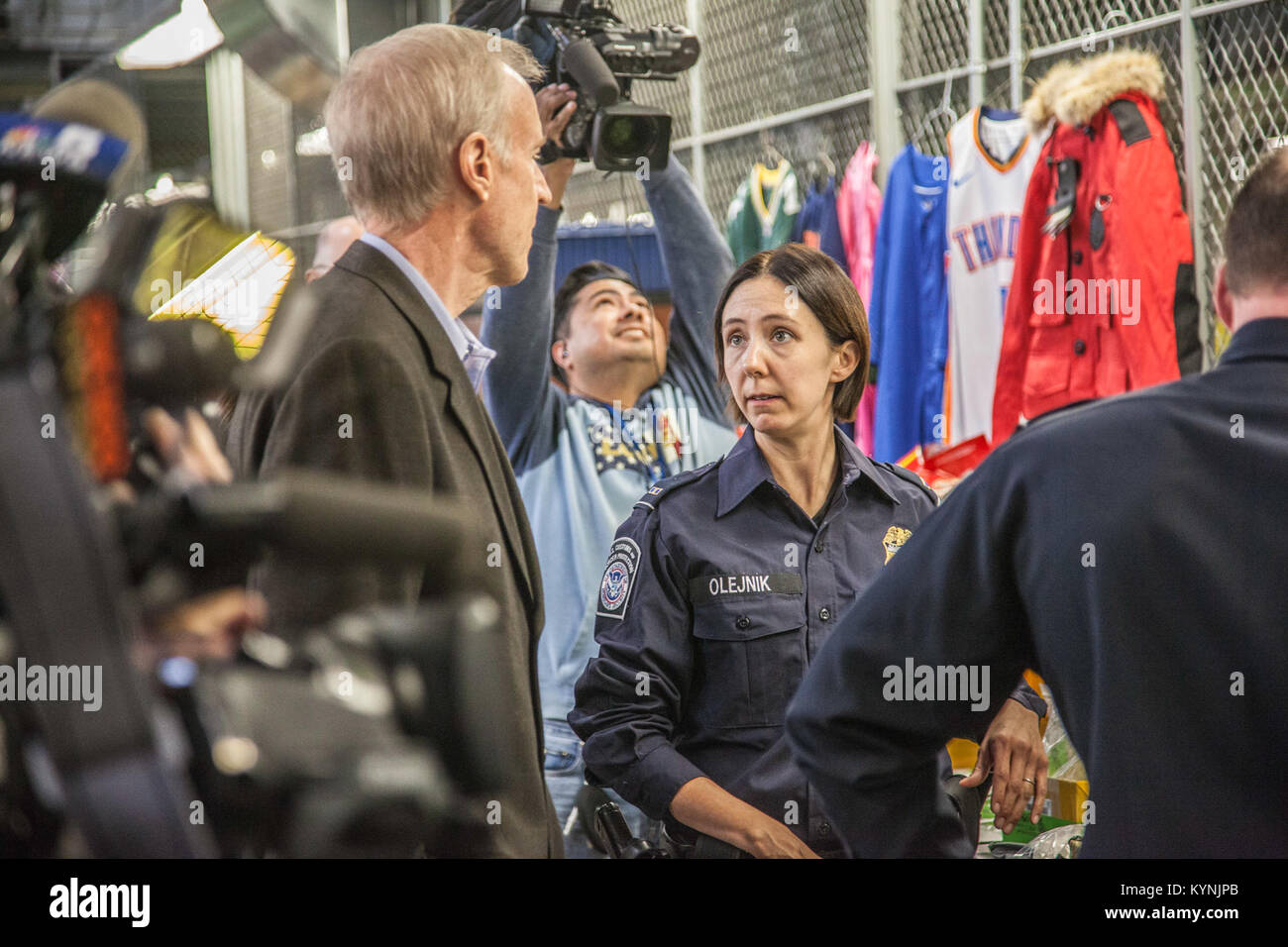 A U.S. Customs and Border Protection officer provides Illinois Governor ...