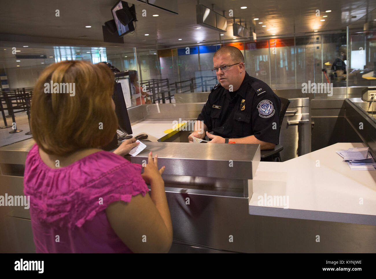 CBP officers process international arrivals at Boston Logan ...