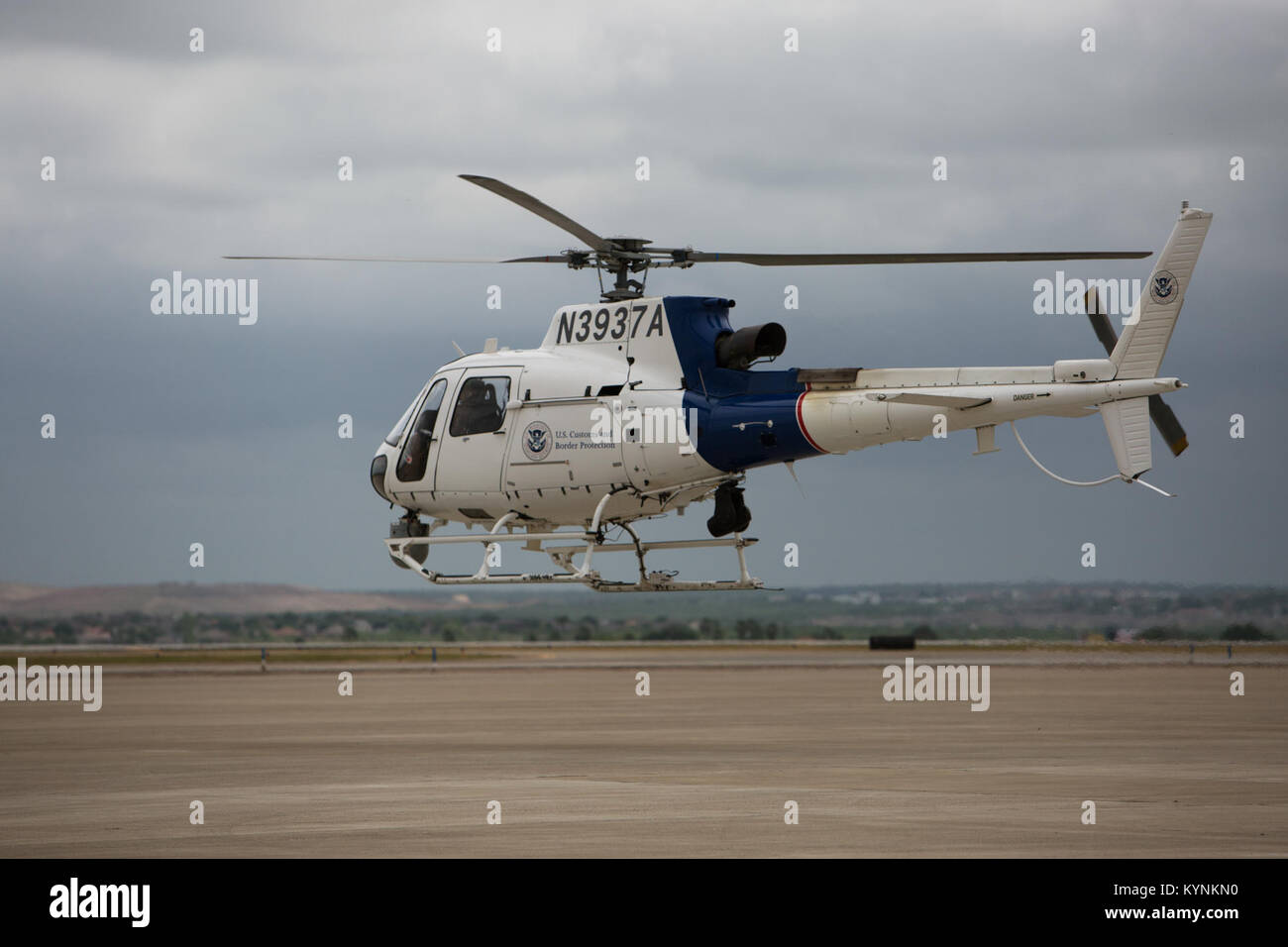 A CBP Air and Marine Operations pilot departs in an Aerostar helicopter ...