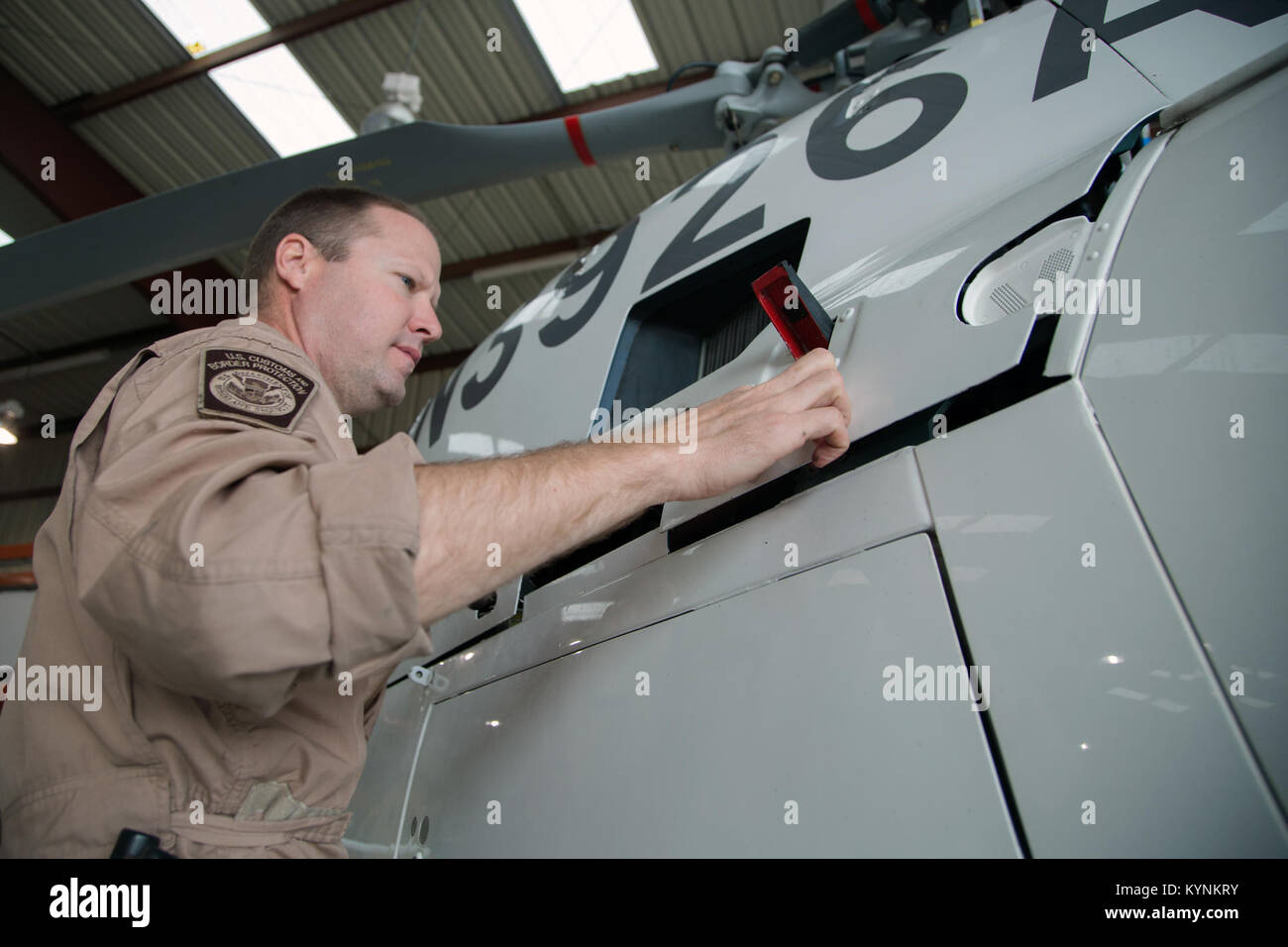 A U.S. Customs and Border Protection pilot conducts a pre-flight ...