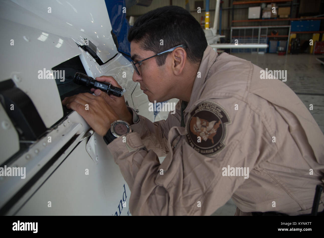 Pilot, conducts a pre flight inspection hi-res stock photography and ...