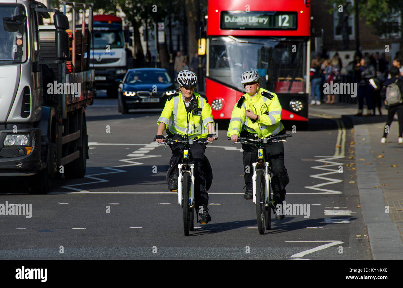 London, England, UK. Two female Metropolitan Police offers on bicycles ...