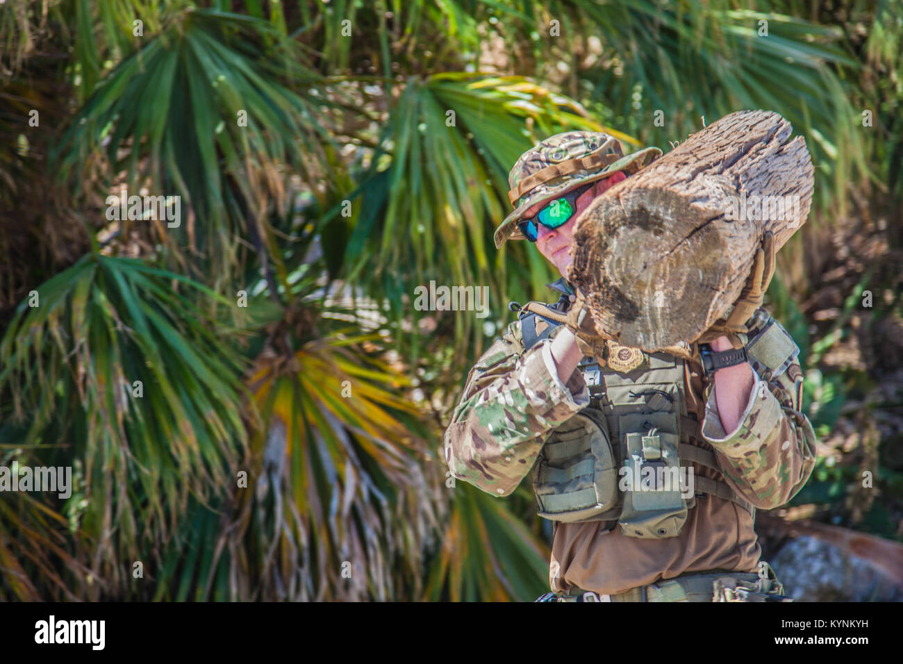 A BORSTAR agent from U.S. Customs and Border Protection clears debris ...