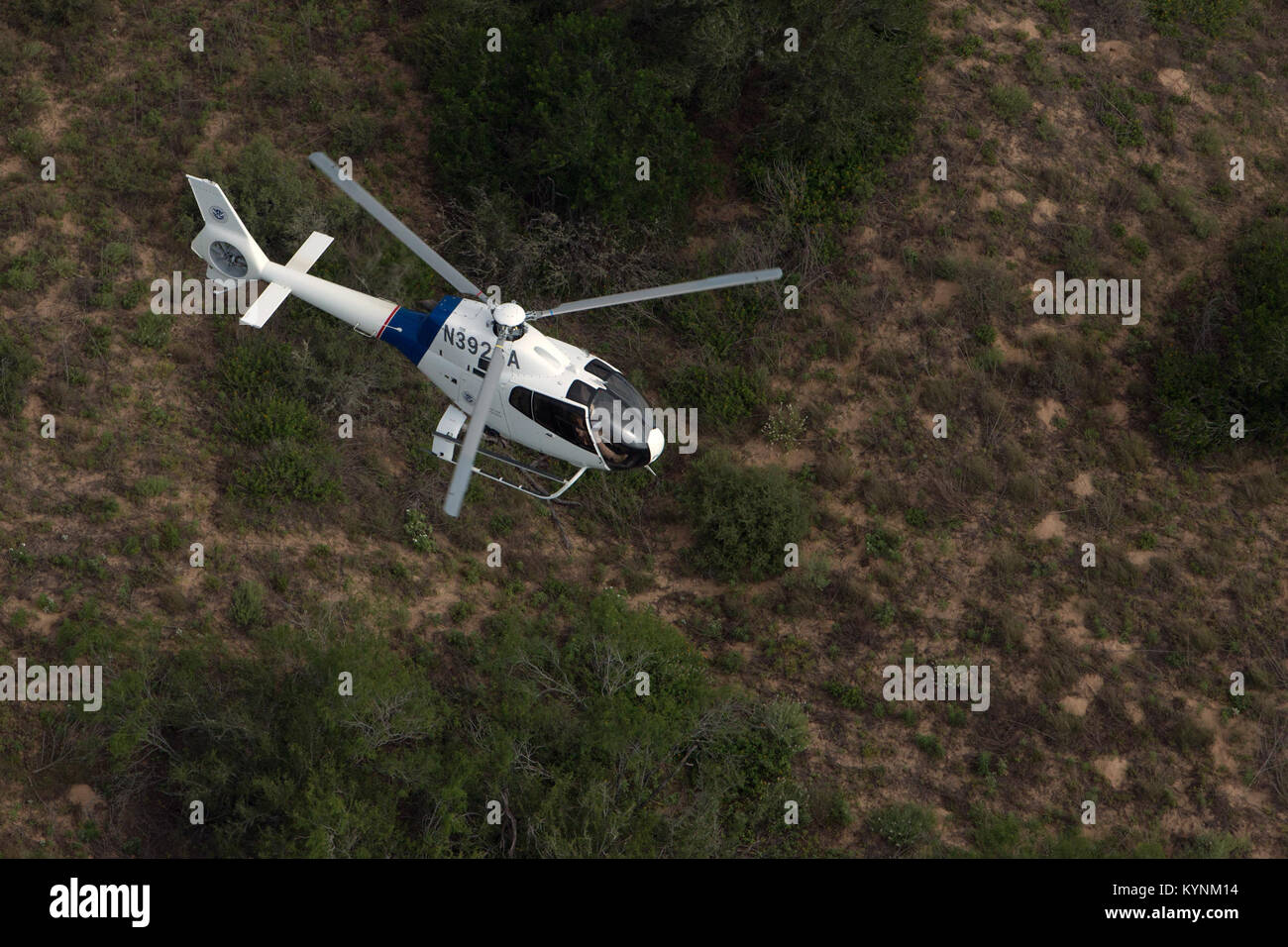 A CBP Air and Marine Operations agent conducts aerial patrols in an ...