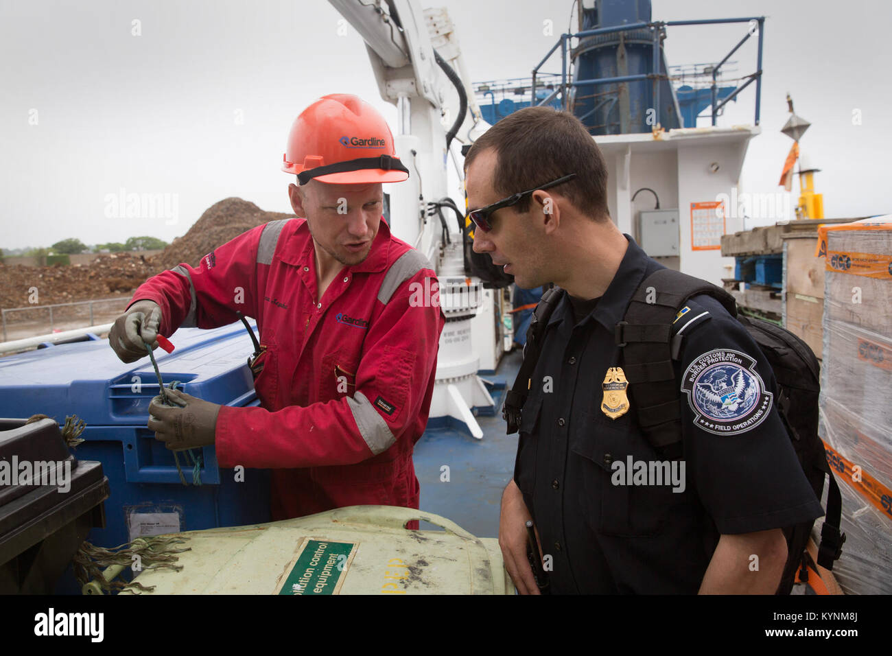 Customs border protection officers inspect hi-res stock photography and ...
