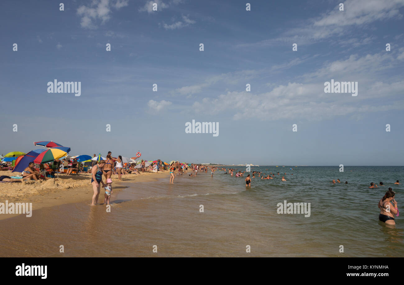 MANTA ROTA, PORTUGAL - AUGUST 25, 2017: People at the famous beach of ...